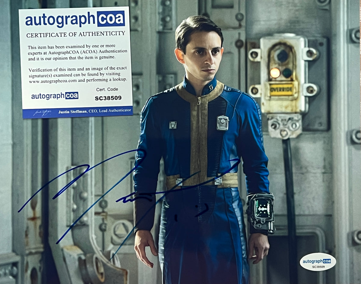 Norm Maclean - Fallout 8x10 signed by Moisés Arias with ACOA – Camel Comics